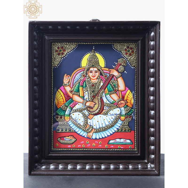 Exotic India Sitting Devi Saraswati Playing Veena | Tanjore Painting with Teakwood Frame | Wayfair